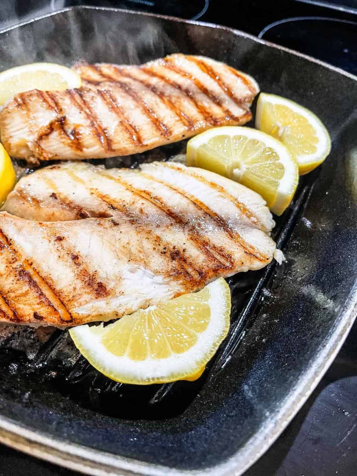 Grilled Lemon Fish with Garlic Butter Sauce - Meghan It Up