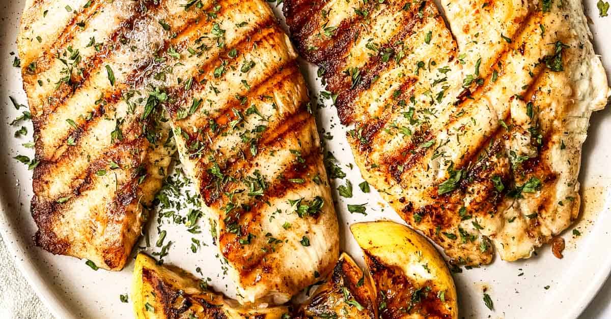 Grilled Lemon Fish with Garlic Butter Sauce - Meghan It Up